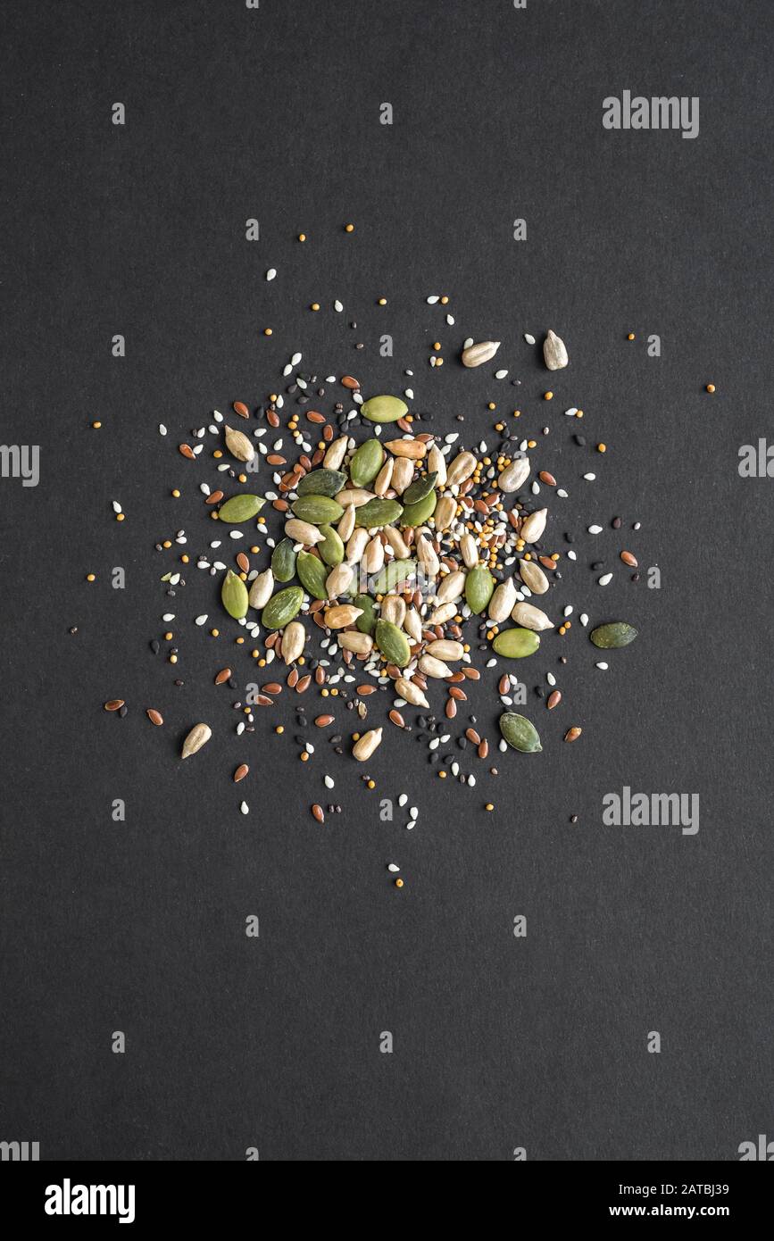 Healthy Seeds Mix for Salads and healthy dishes. Pile of mixed seeds on ...