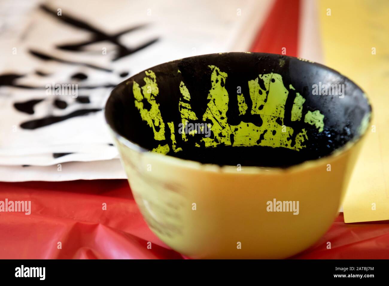 A plate with black ink for Calligraphy Stock Photo - Alamy