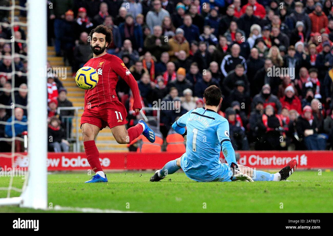 Liverpool's Mohamed Salah (left) scores his side's third goal of the ...