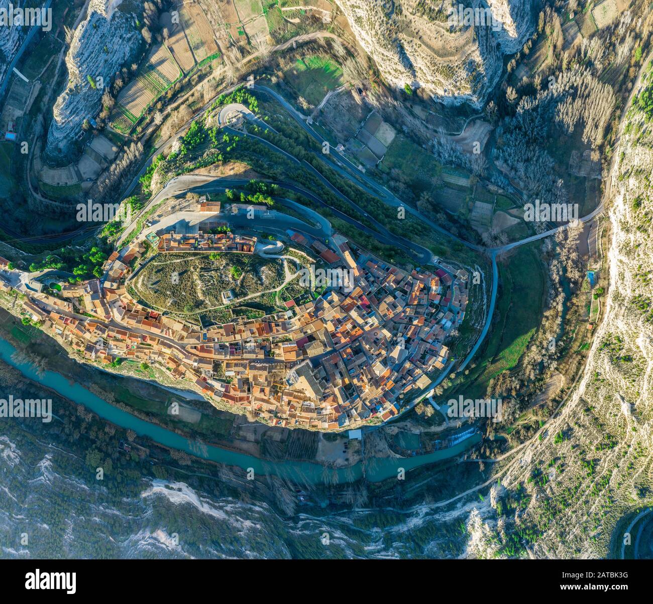 Aerial top down view of the Jucar river surrounding the medieval ...