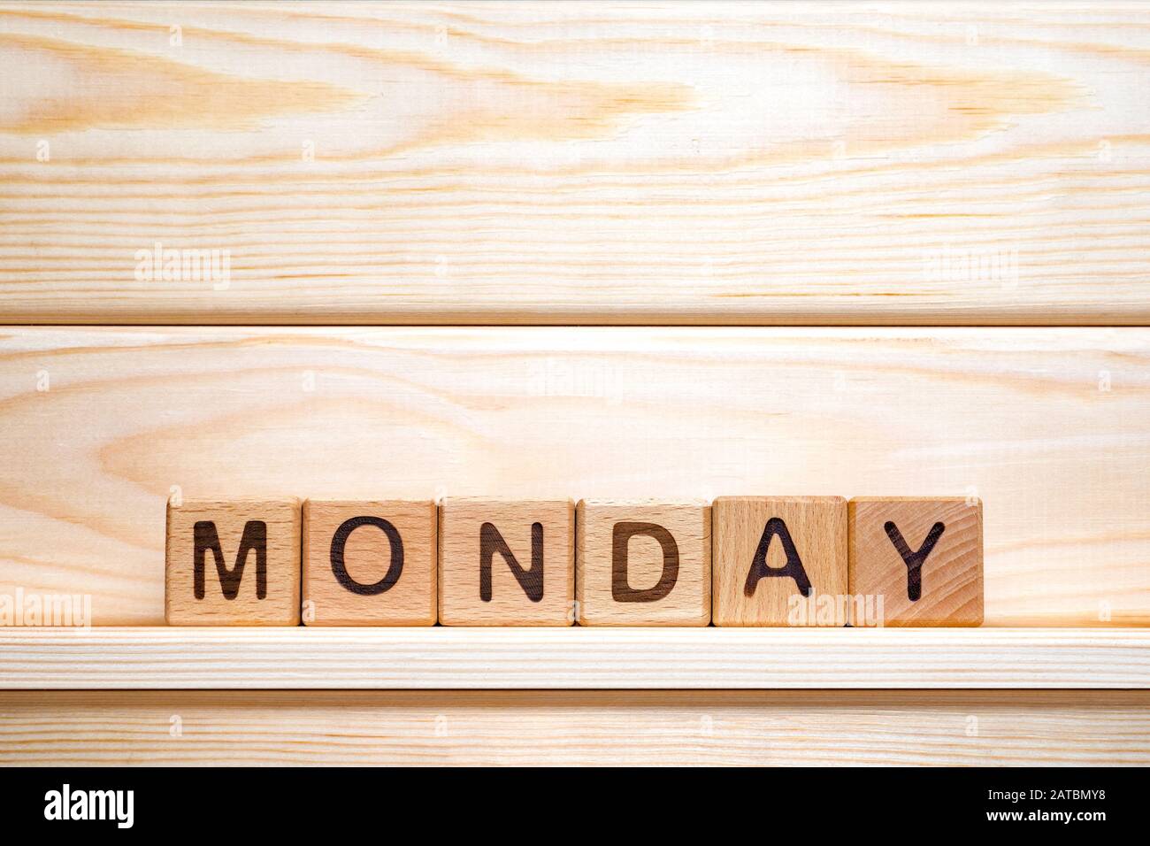 Day of the week. Monday made from vintage wooden cubes. Small business ...