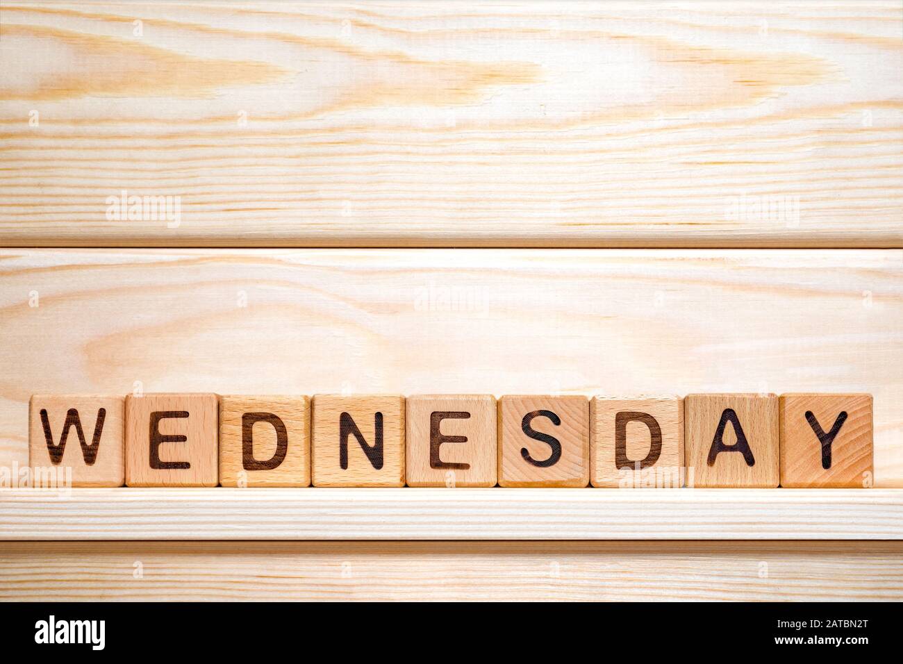 Wednesday written on toy cubes. Middle of working week. Day of the week ...