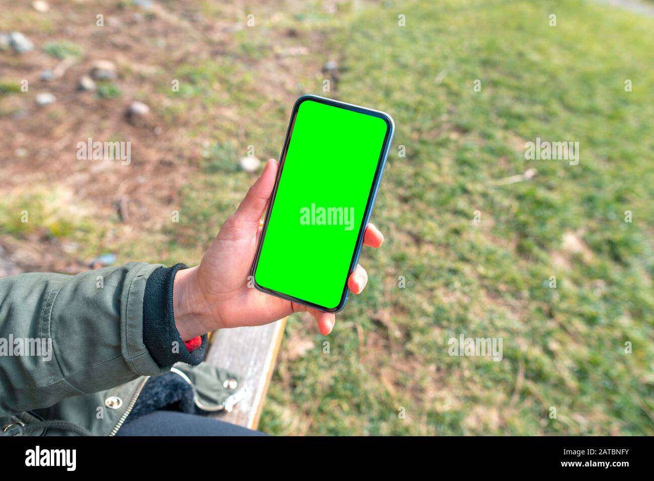 Mockup image of smart phone with green blank screen template, woman ...