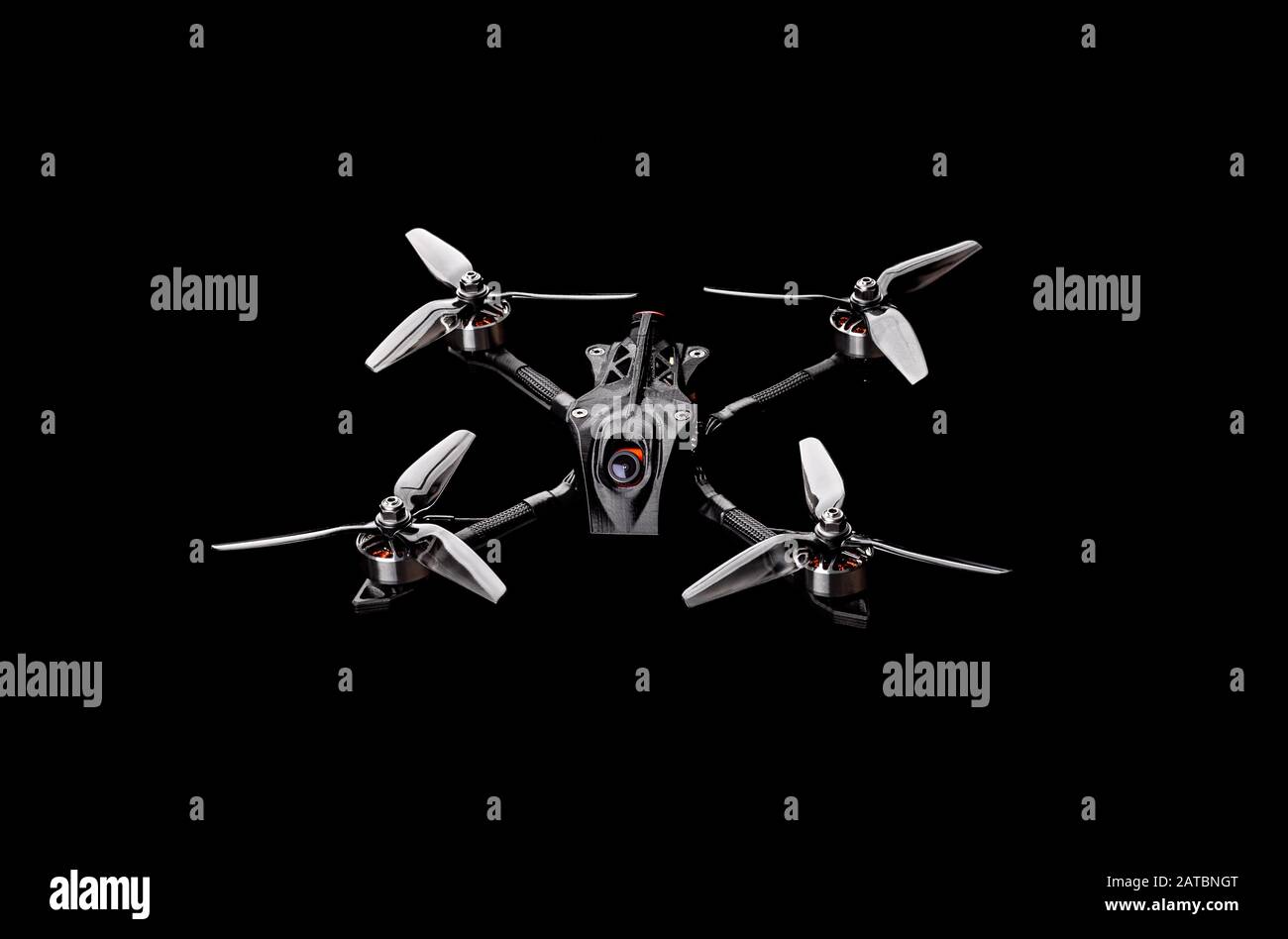 Modern FPV drone on a black background. Four-engine aircraft on the ...