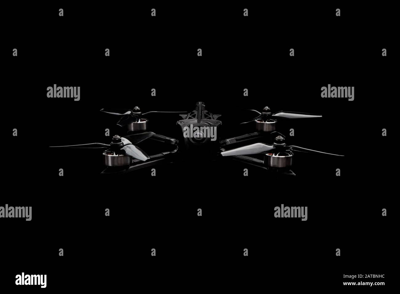Modern FPV drone on a black background. Four-engine aircraft on the ...
