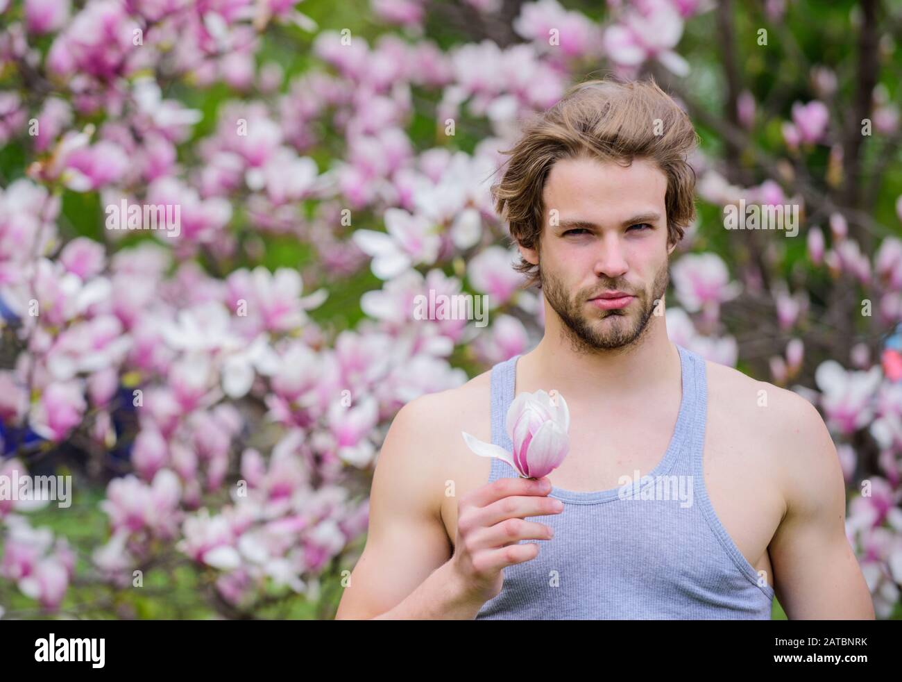 Man flowers background defocused. Botany nature. Male beauty. Hair care ...