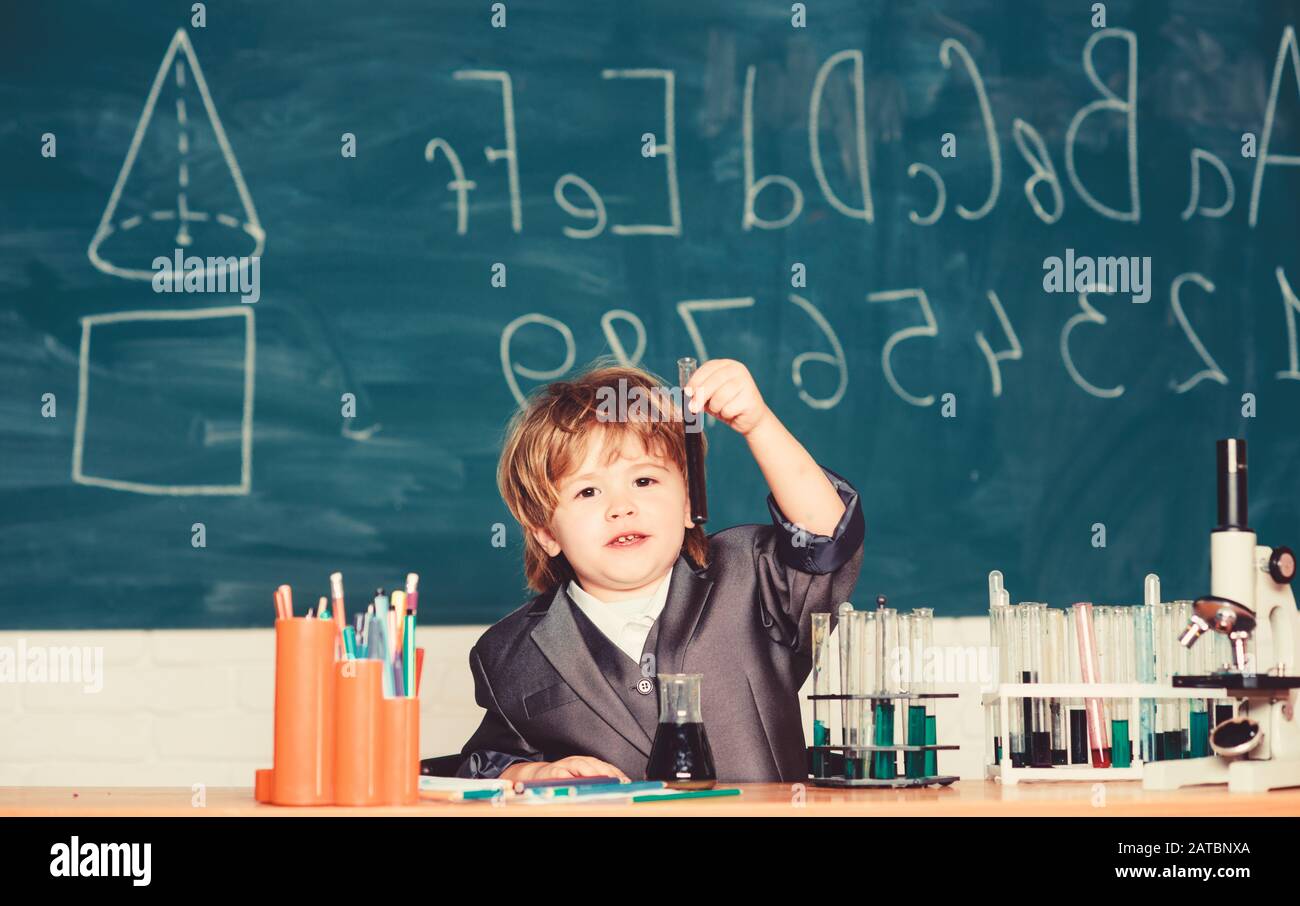 Kid study biology chemistry. Happy childhood. Child enjoy studying. Boy ...