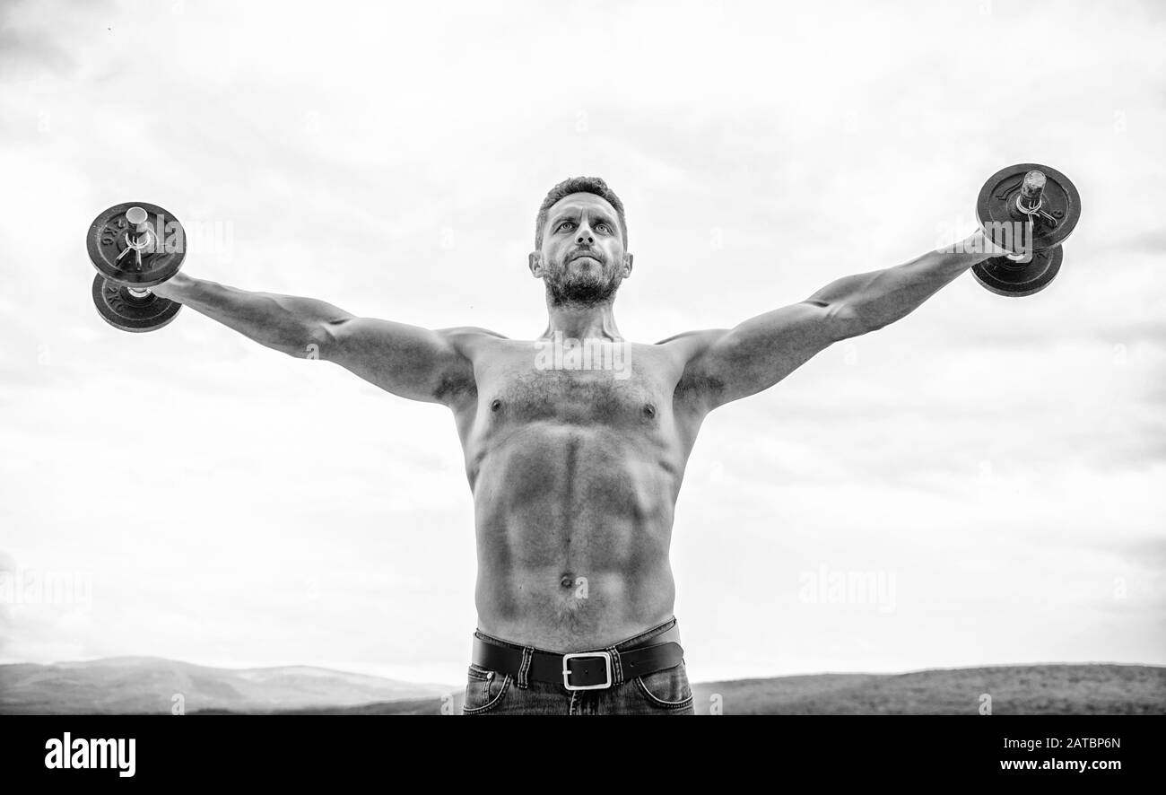 Muscular man exercising with dumbbell. Dumbbell exercise. Strong biceps ...