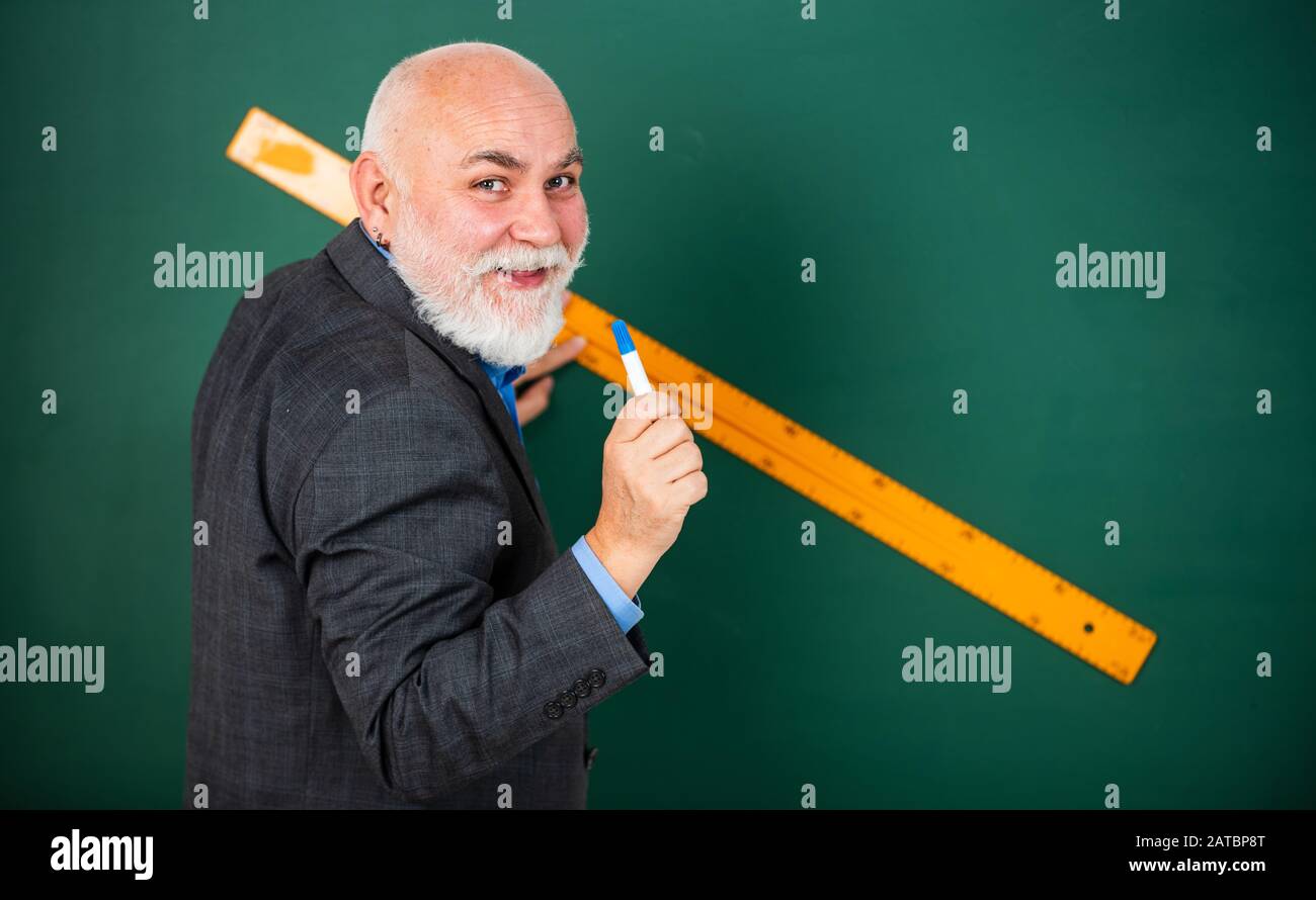 Education and knowledge. geometric shapes at high school. senior man ...