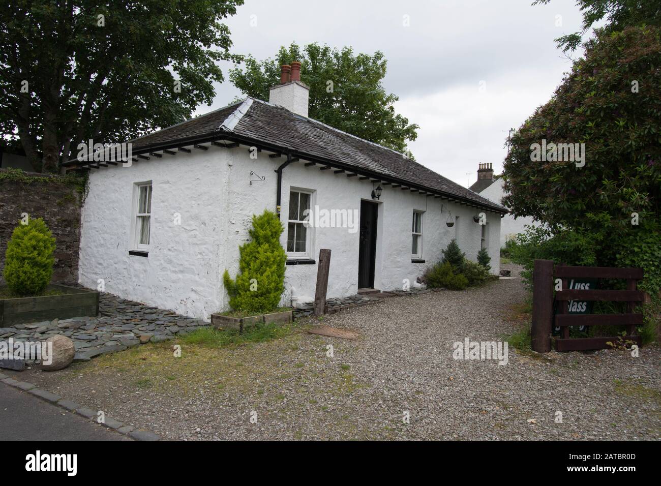 White house Luss Scotland gravel outside bungalow slate roof painted ...