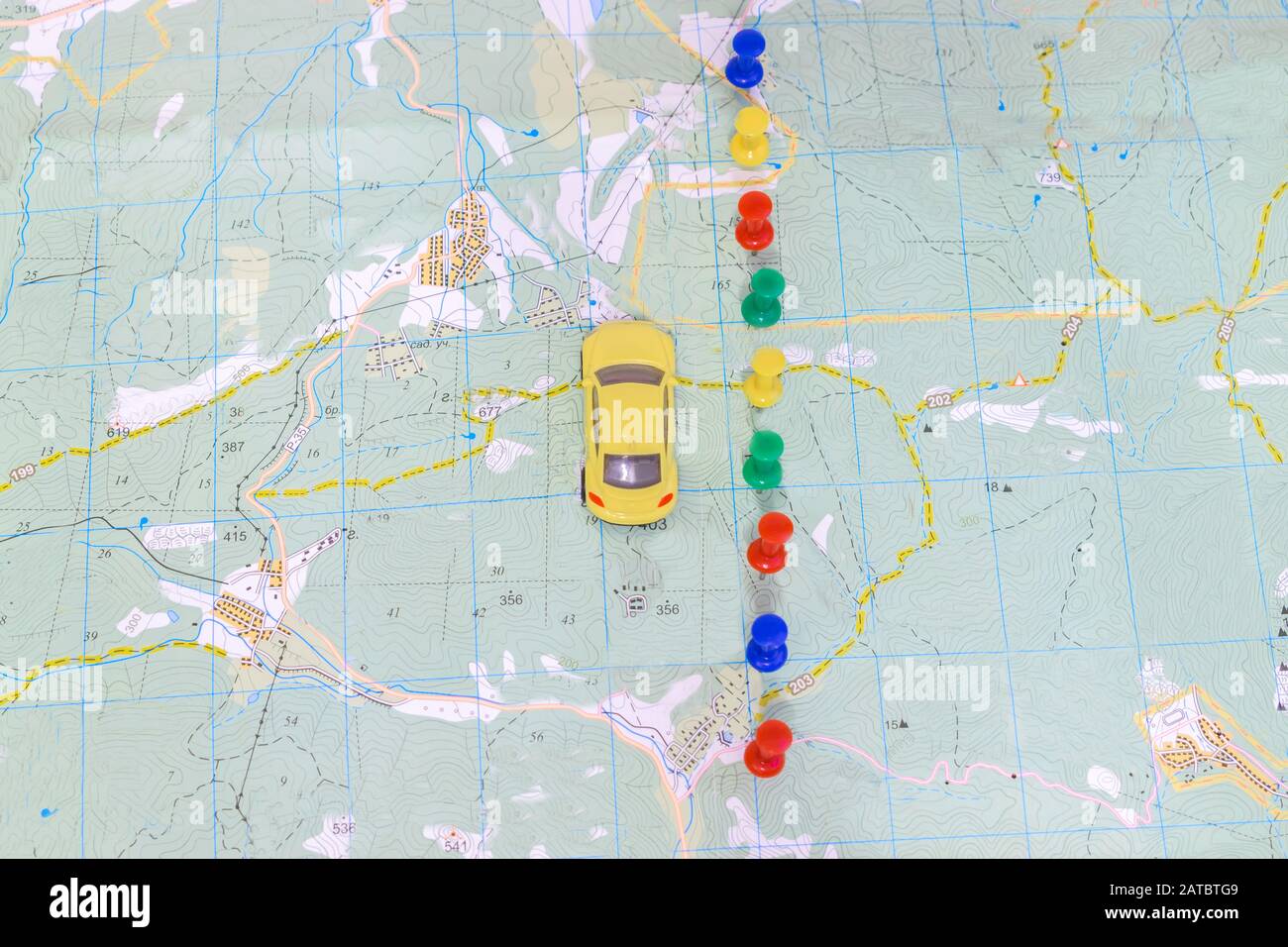 The yellow car travels along the coordinates marked on the geographic ...