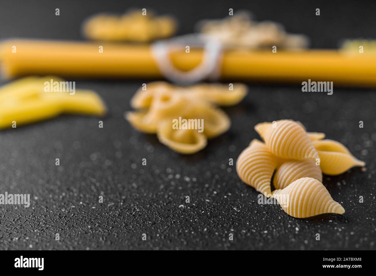 Close up of different dry pasta types against black background Stock ...