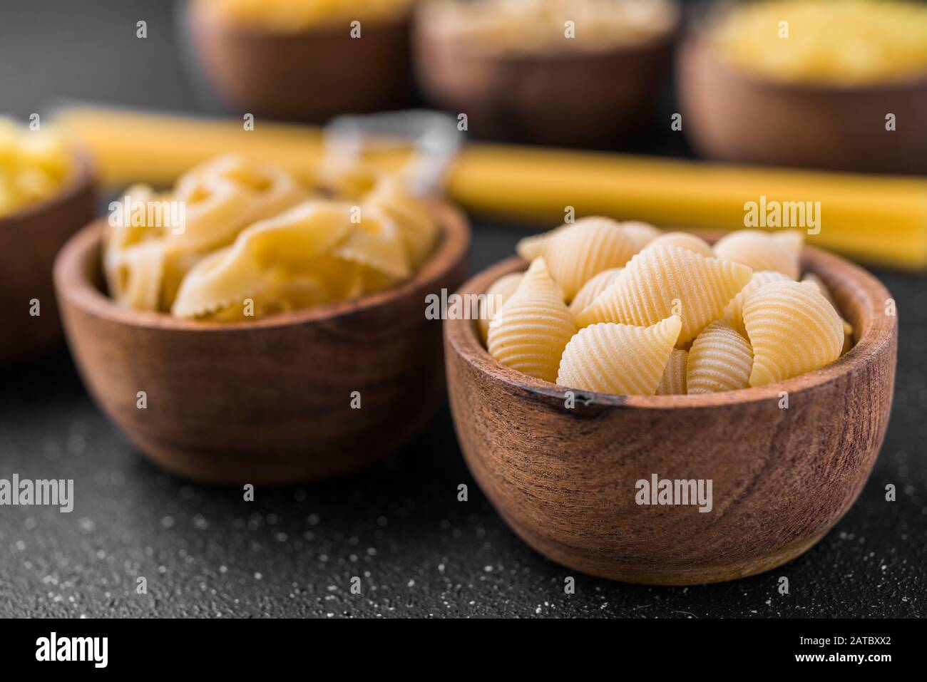 Close up of different dry pasta types against black background Stock ...