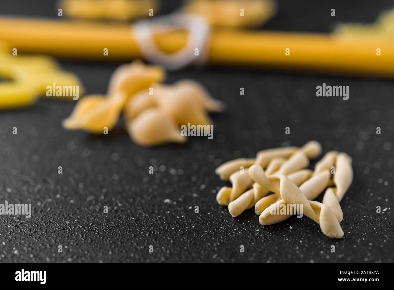 Close up of different dry pasta types against black background Stock ...
