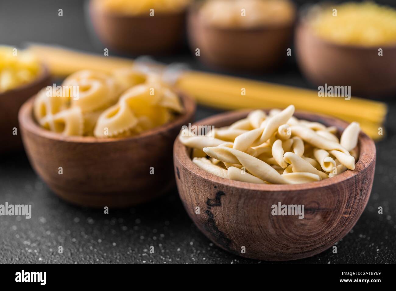 Close up of different dry pasta types against black background Stock ...