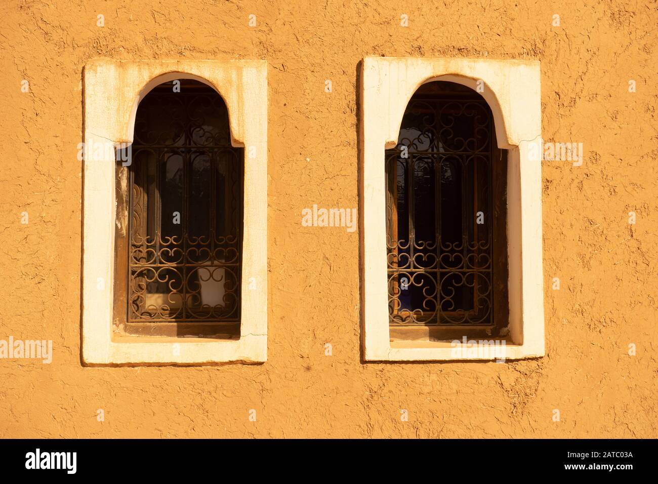 traditional windows in the facade of a house in the oasis of Tinghbert ...