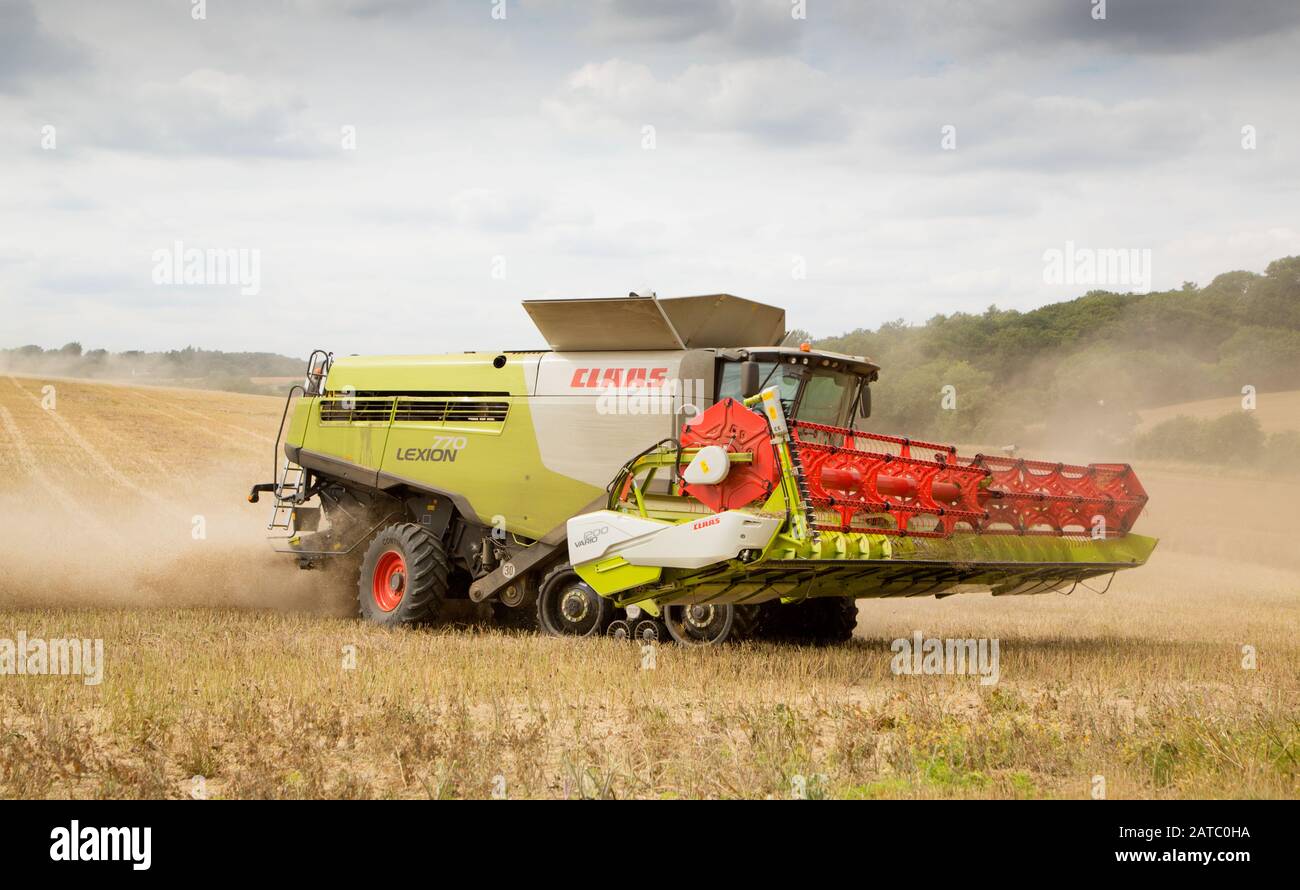 Combine Harvester harvesting on a summers day. Much Hadham ...