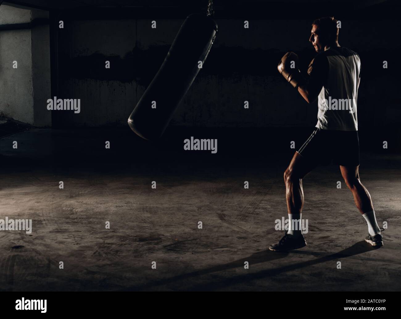 Young man in boxing gloves. Boxing man ready to fight. Boxing, workout ...