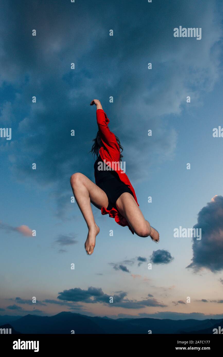Young graceful woman ballet dancer, dressed in professional outfit ...
