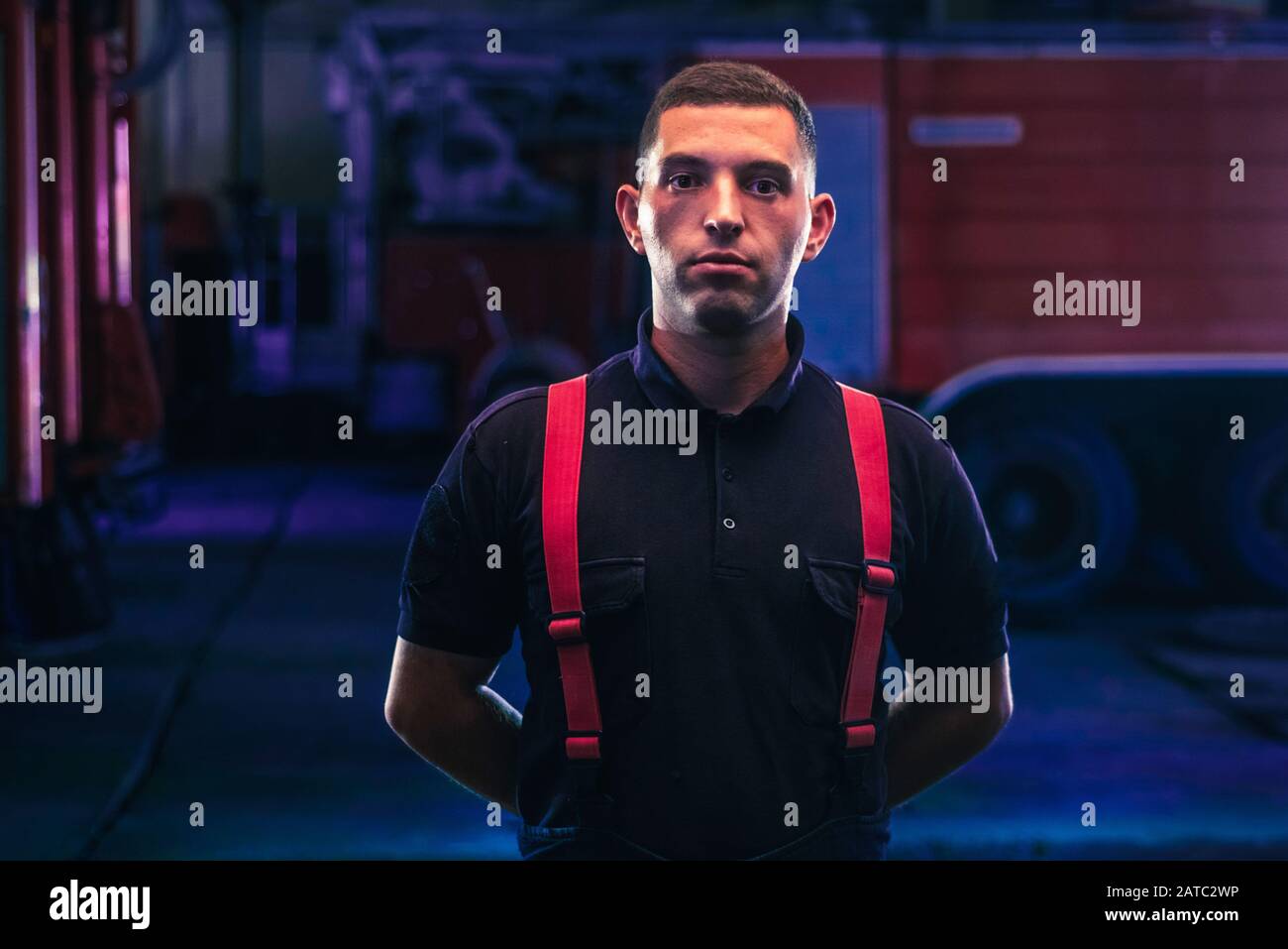 Portrait of a firefighter with uniform inside the fire station Stock ...