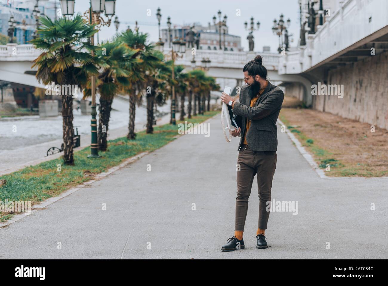 Modern day hipster wearing classy outfit at the river promenade Stock ...