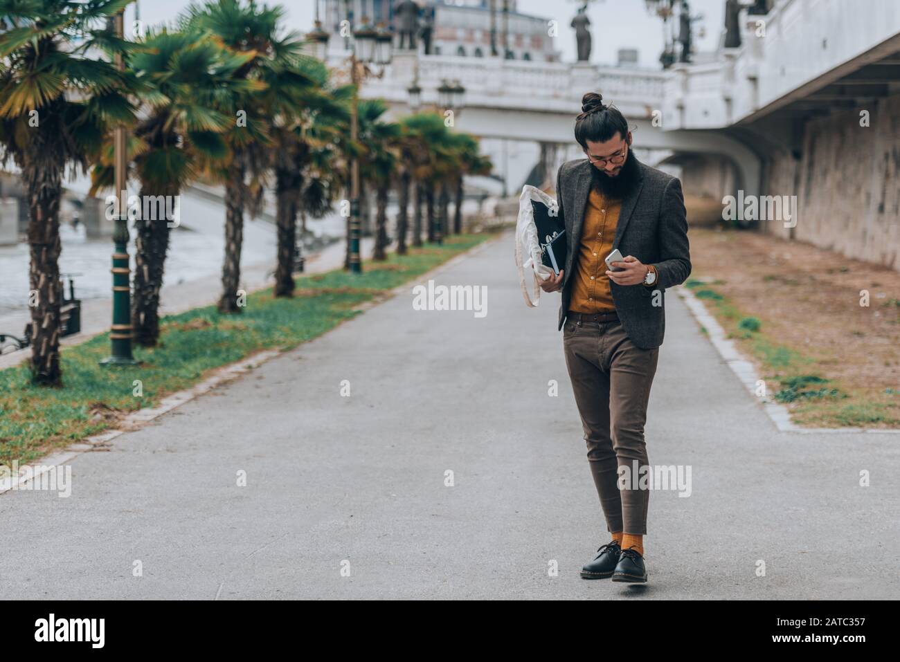 Modern day hipster wearing classy outfit at the river promenade Stock ...