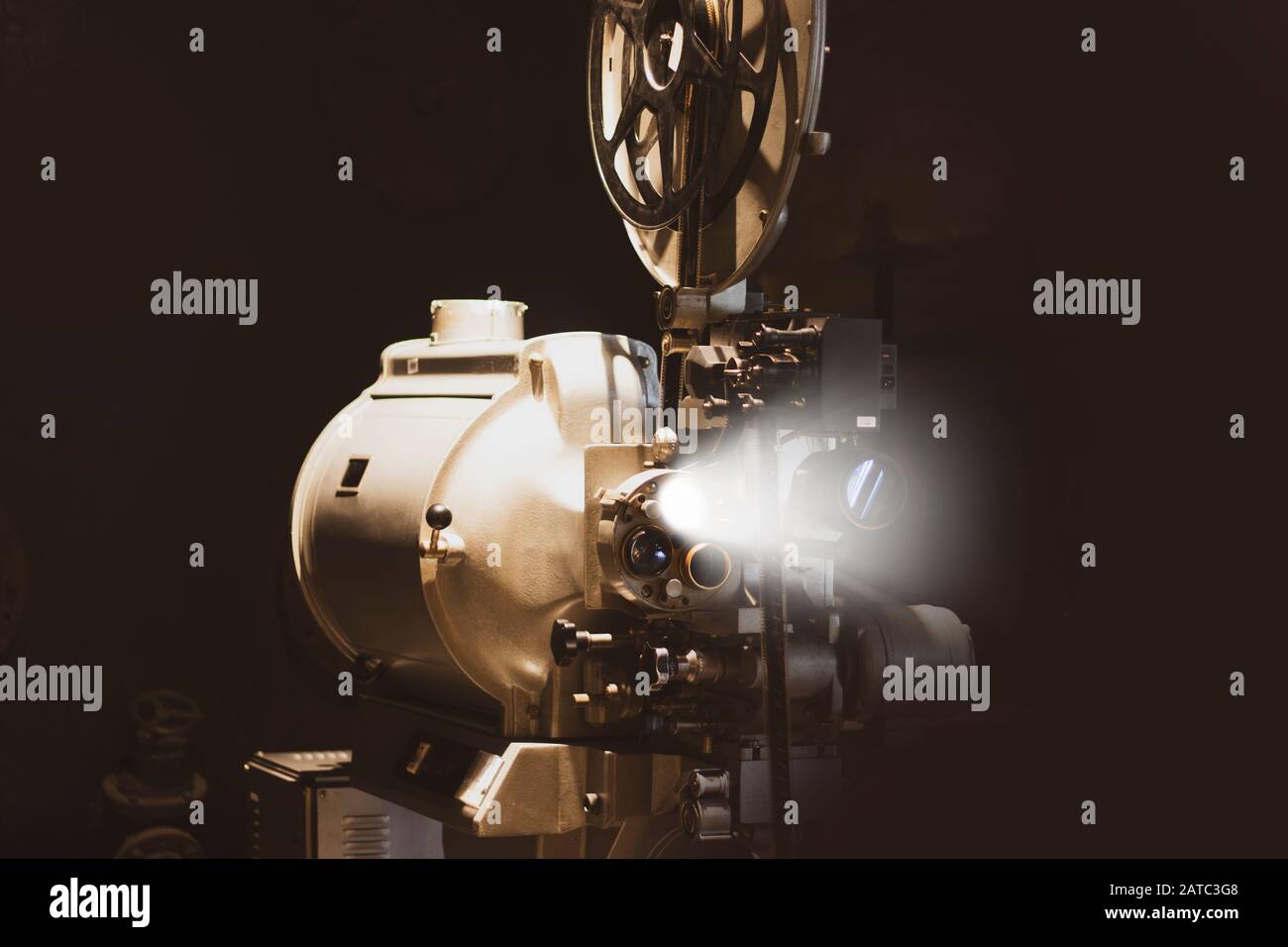 Vintage movie, cinema and movie reel projector on dark background Stock ...