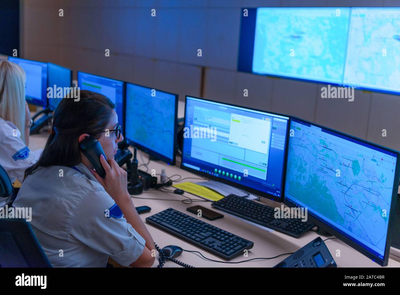 Technical Operator Works at His Workstation with Multiple Displays ...