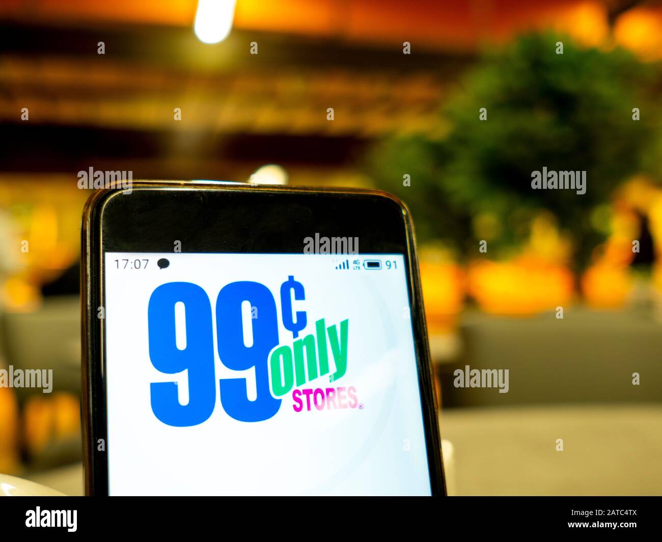 In this photo illustration the 99 cents store logo is seen displayed on ...