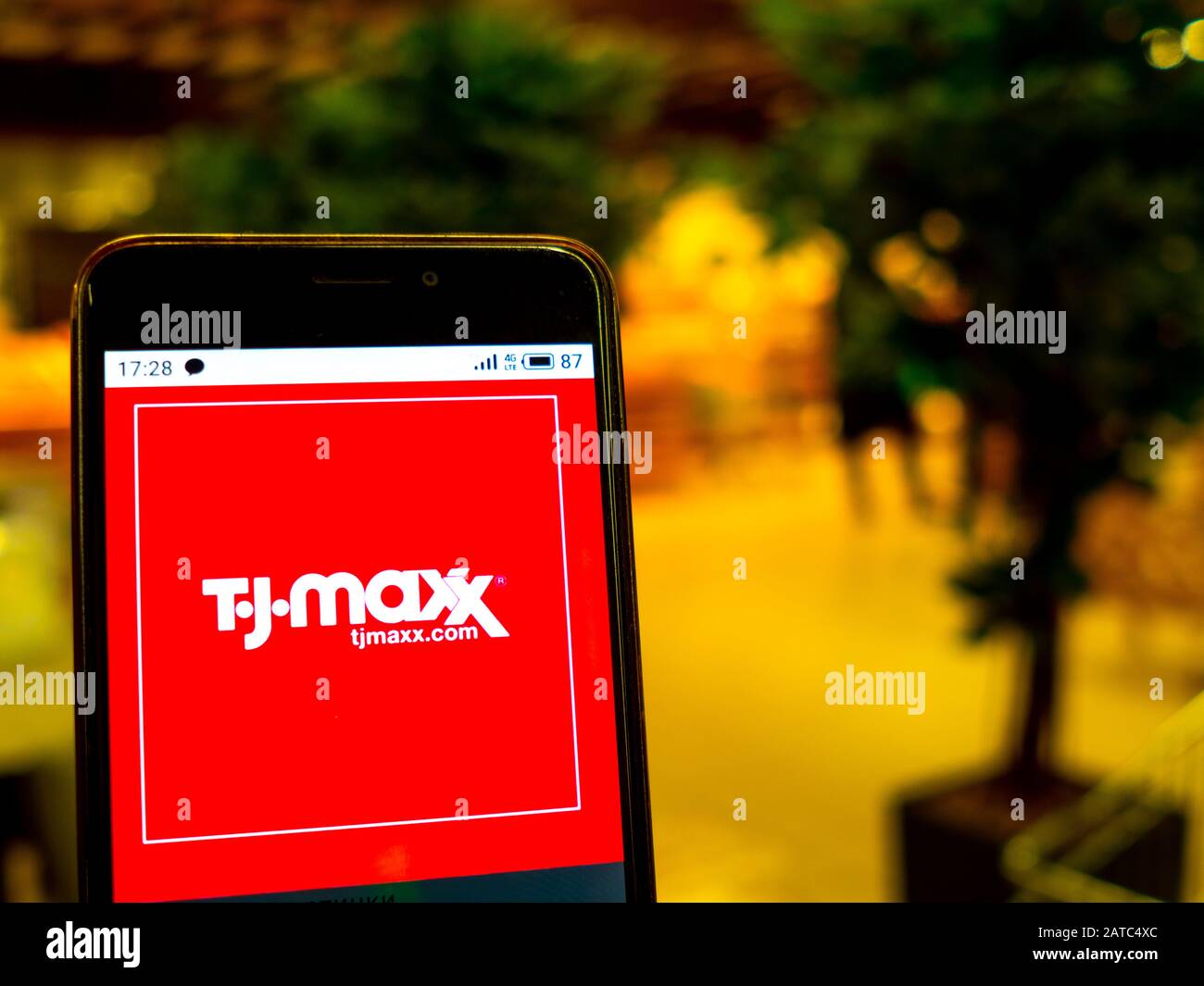 In this photo illustration the T.J. Maxx logo is seen displayed on a ...