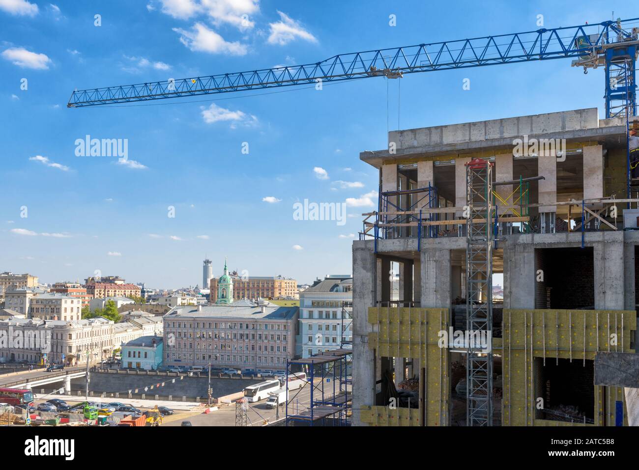 Construction site with crane in Moscow, Russia. Top of building under ...