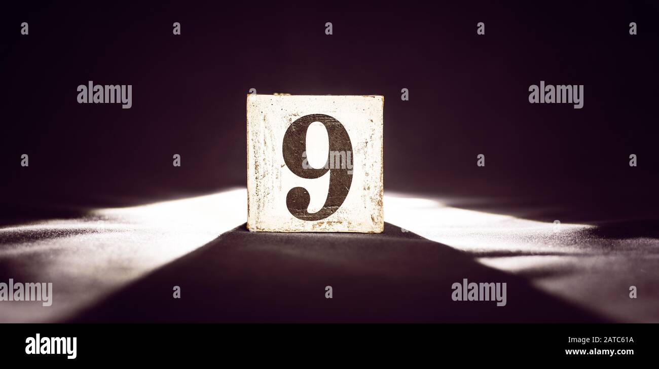 Number nine, 9, on an old rustich wooden block Stock Photo - Alamy