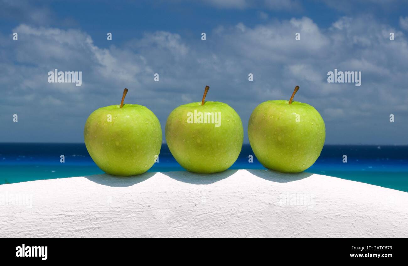 Perfect Fresh Green Apples Caribbean sea and blue sky Background in ...