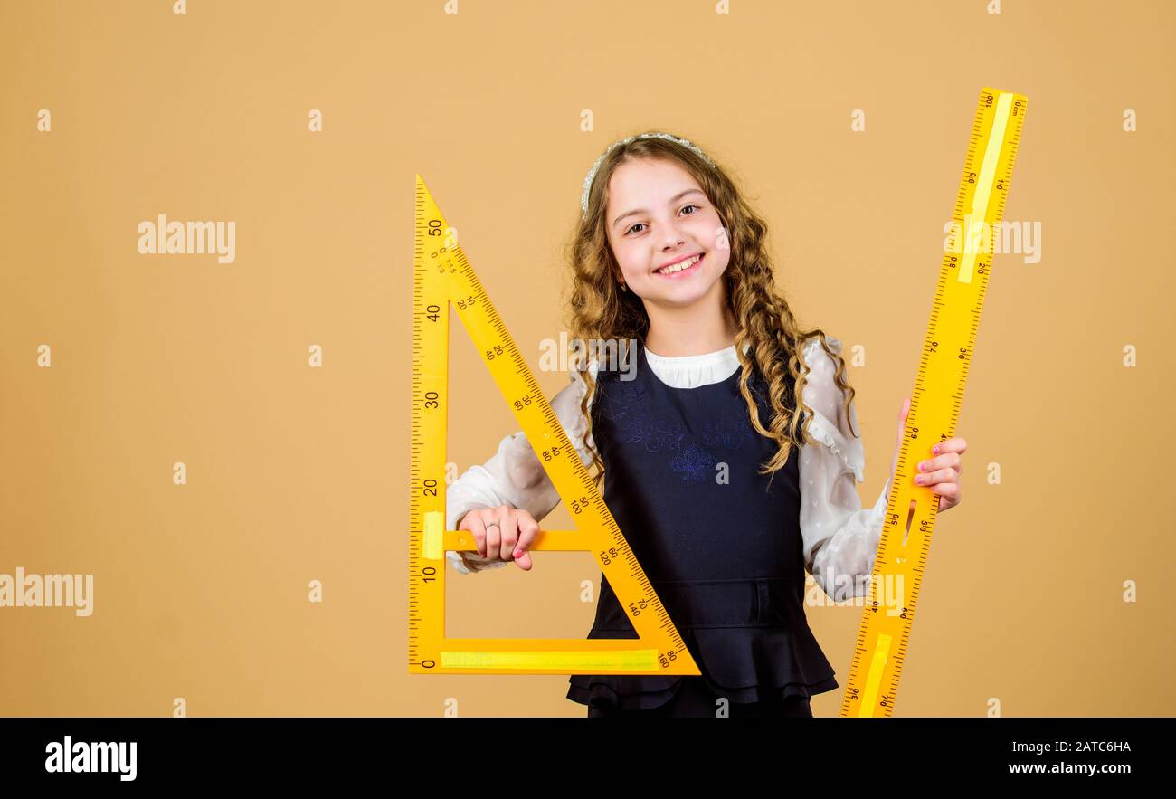 School student learning geometry. Pupil girl with big rulers. small ...