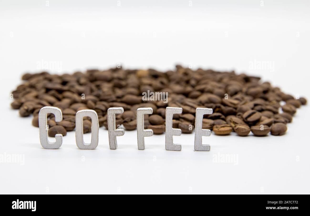 Coffee written in wooden letters and coffee beans isolated on white ...