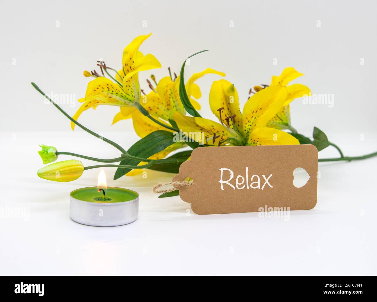 Relax, a light and a flower isolated on white background Stock Photo ...