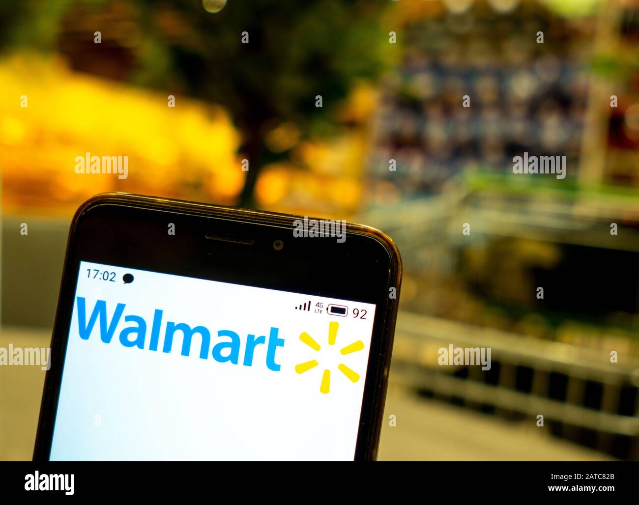 In this photo illustration the Walmart logo is seen displayed on a ...