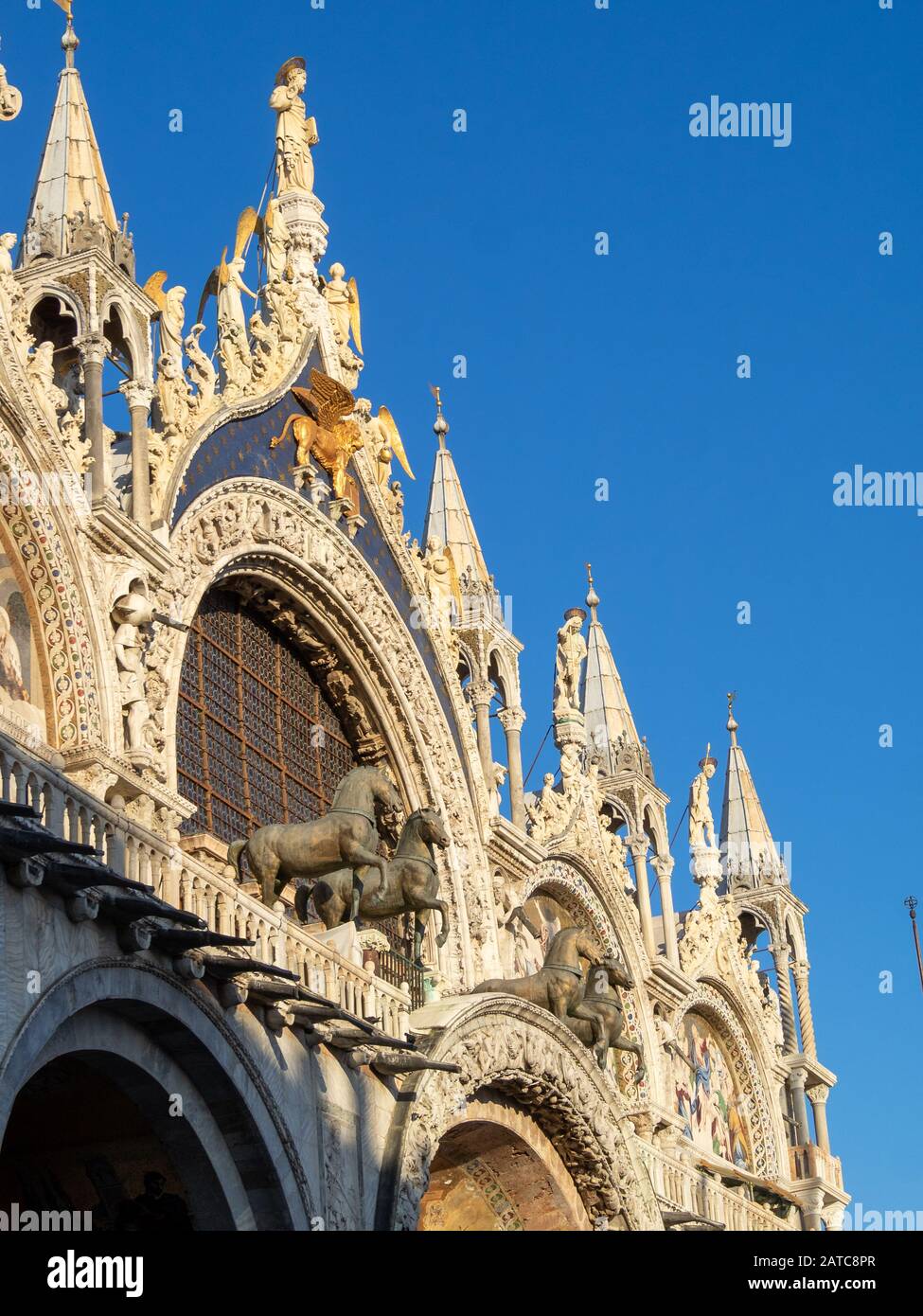 San Marco Basilica facade with St. Mark statue, the winged lion and the ...
