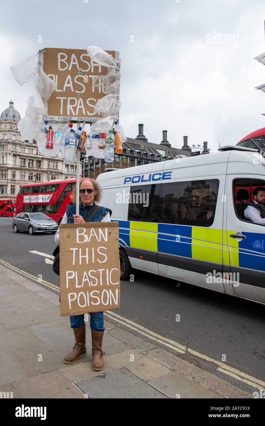 Westminster, London, UK. 1st May, 2019. A man holds up a Bash Plastic ...