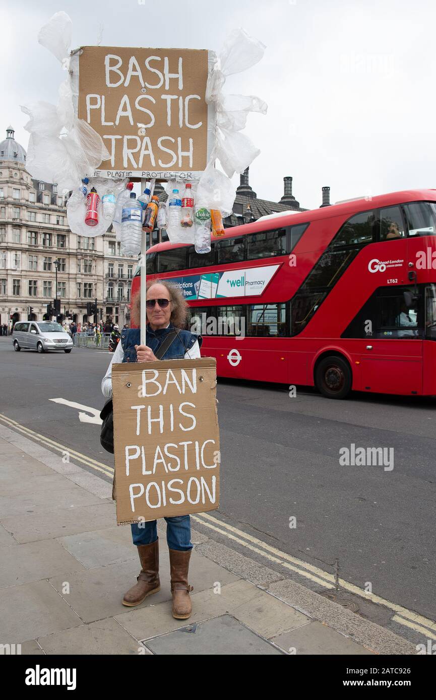 Westminster, London, UK. 1st May, 2019. A man holds up a Bash Plastic ...