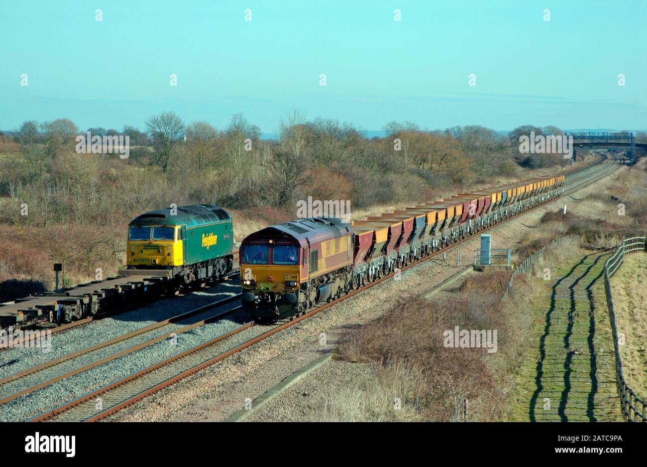 A pair of freight trains worked by a class 57 number 57011 and a class ...