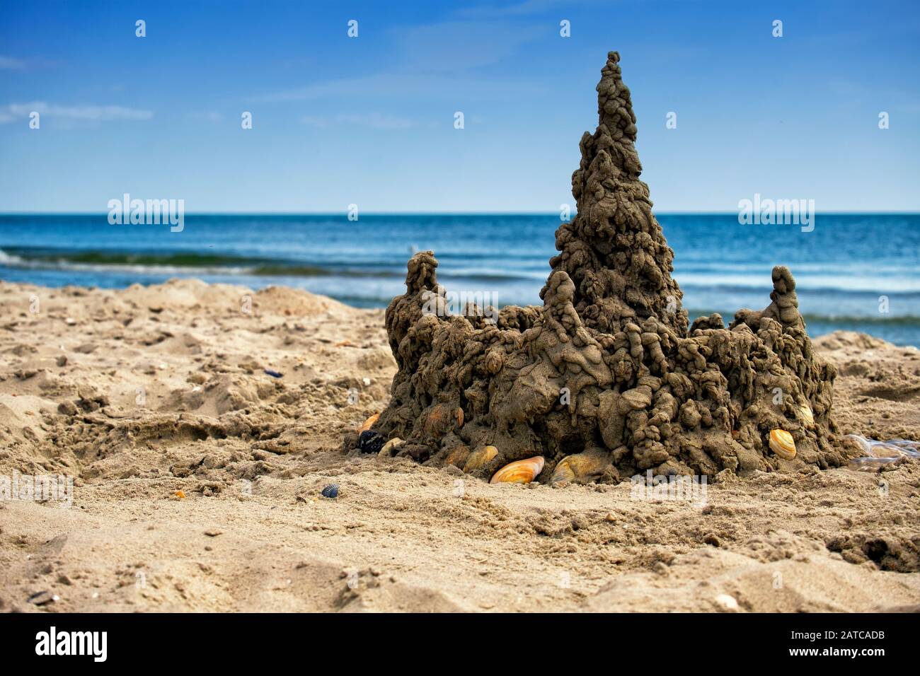 Fancy sand and seashell castle by the sea Stock Photo - Alamy