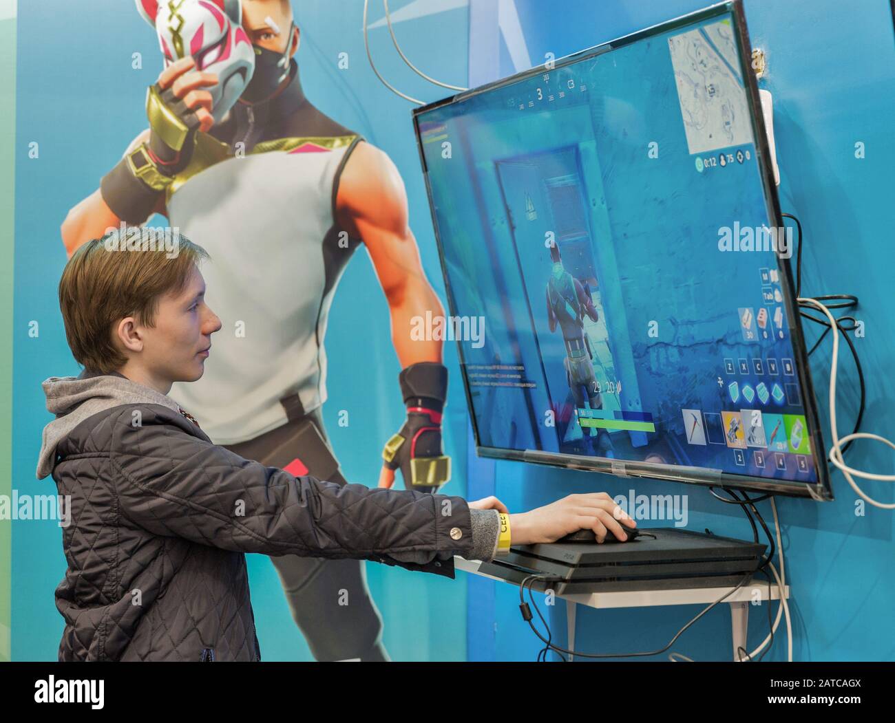 KYIV, UKRAINE - APRIL 06, 2019: Boy teenager playing Sony Play Station ...