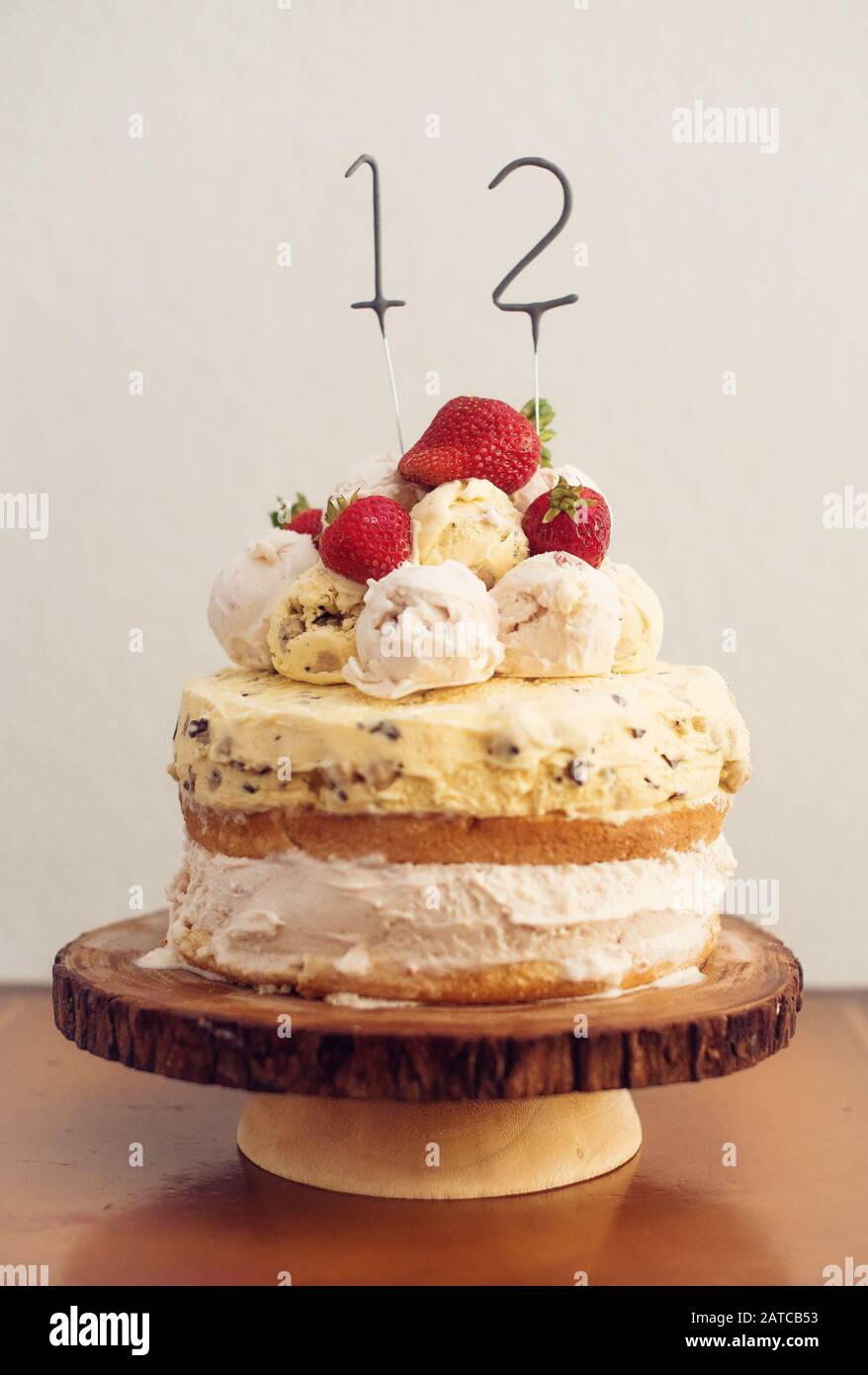 Home made ice-cream birthday cake with birthday sparklers in the number ...