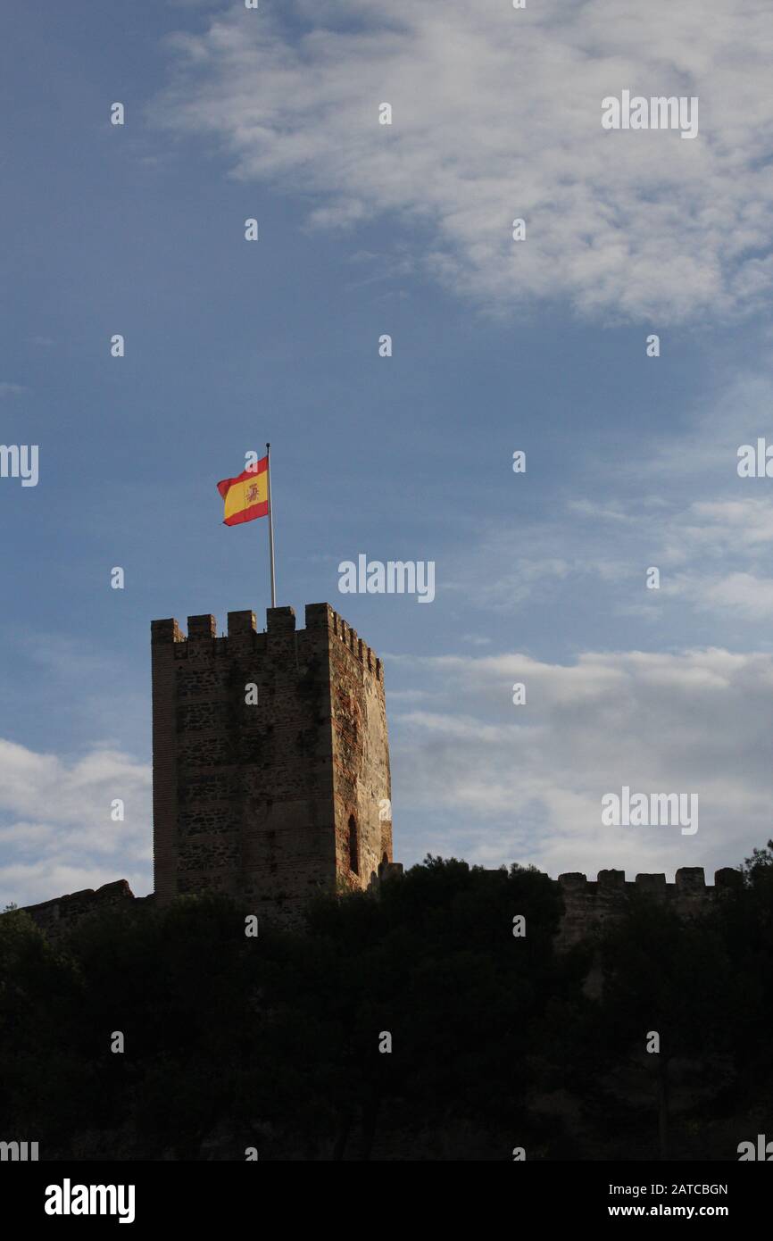 Sohail Castle, Fuengirola with Spanish flag flying on sunny day Stock ...