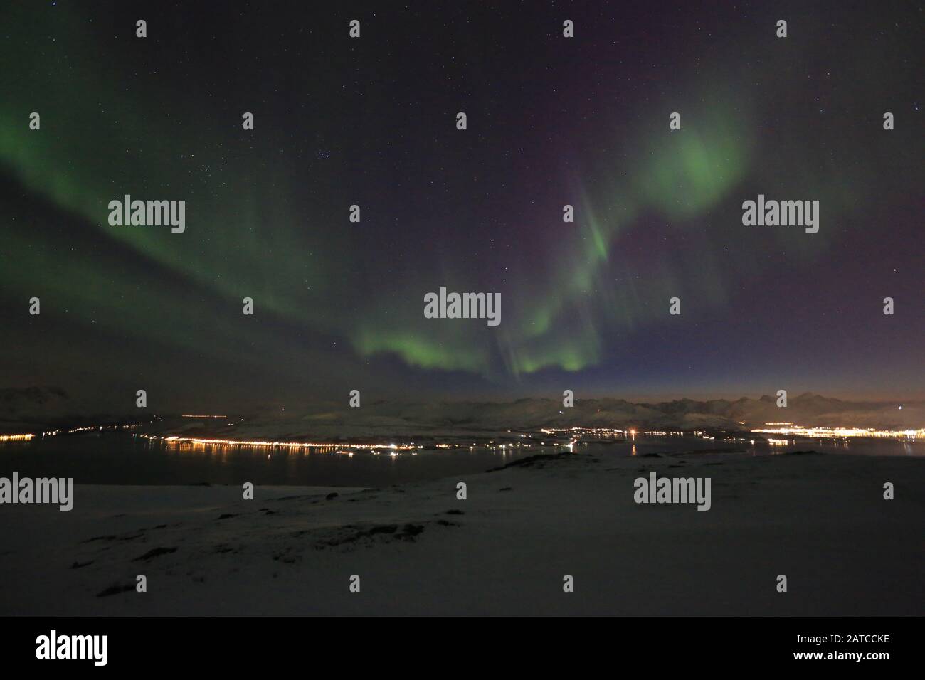 Northern Lights Over Winter Mountains Stock Photo - Alamy