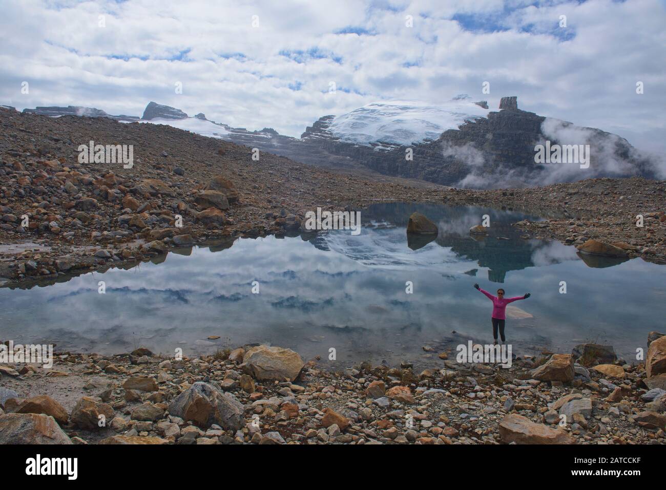 Pan de Azucar and Pulpito Del Diablo reflected in high altitude tarn ...