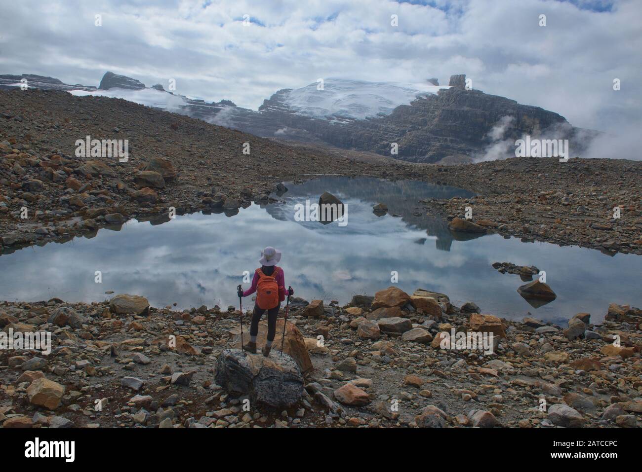 Pan de Azucar and Pulpito Del Diablo reflected in high altitude tarn ...