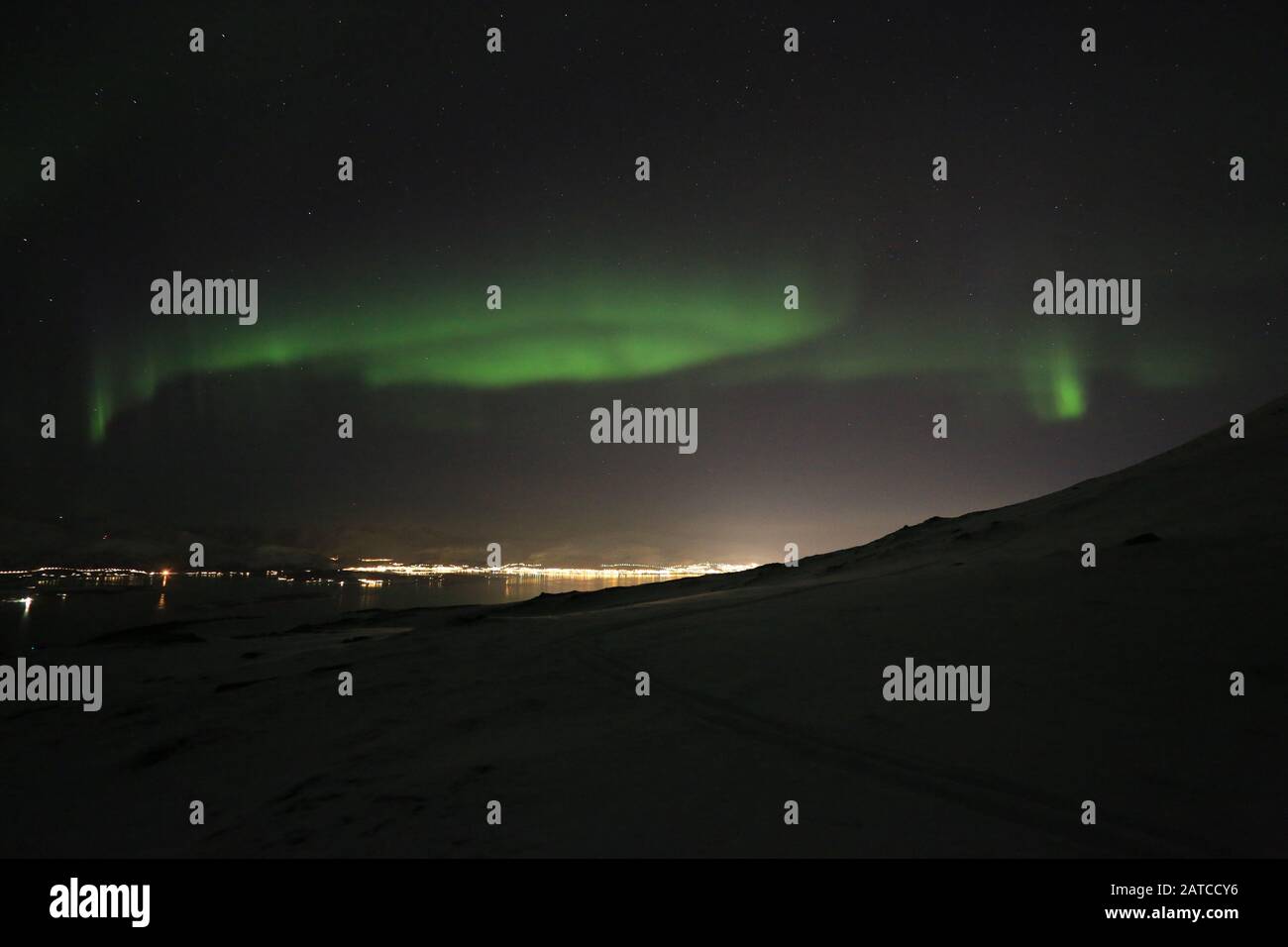 Northern Lights Over Winter Mountains Stock Photo - Alamy