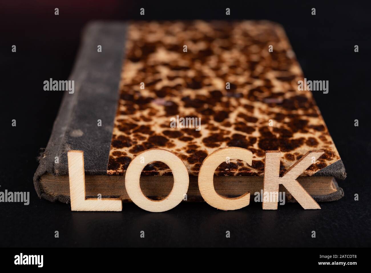 The word lock arranged from wooden letters on the background of the old ...